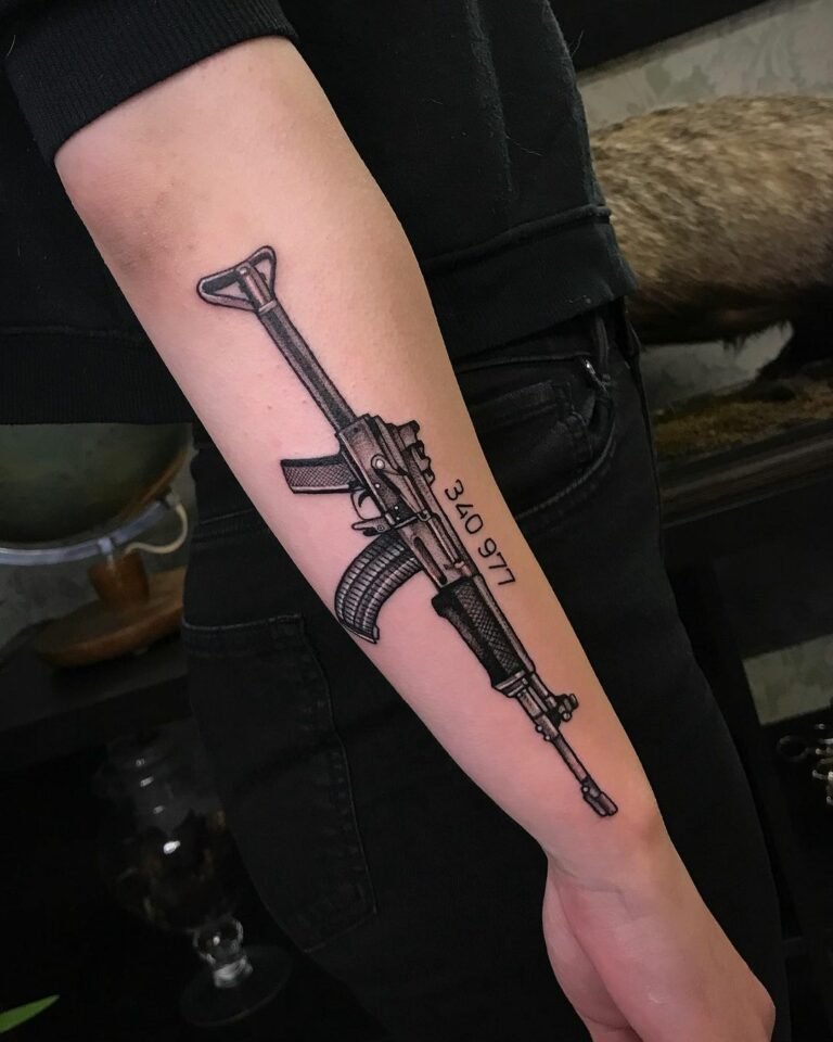 Inspiring Gun Tattoo Designs & Interpretations